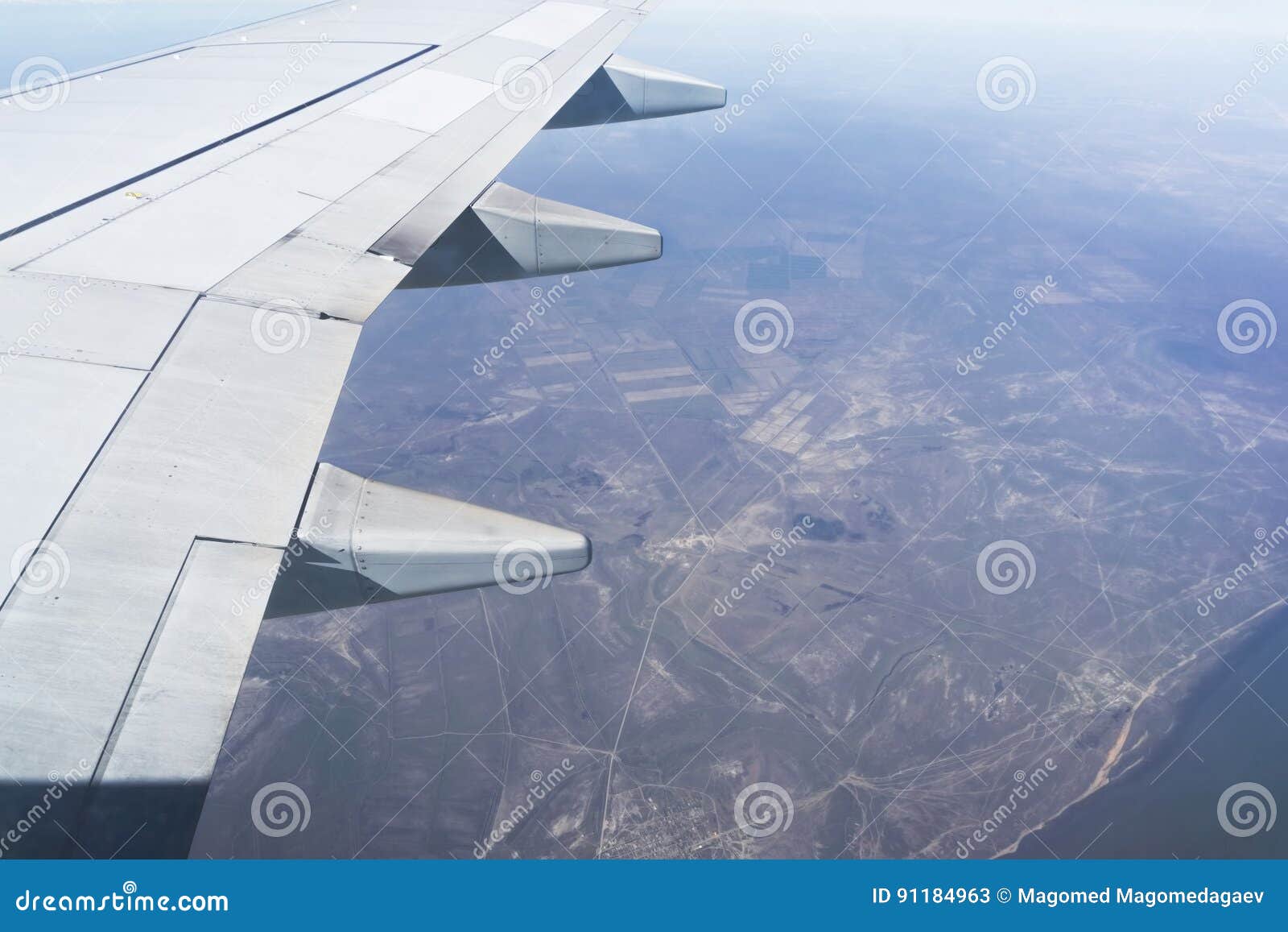 Flight over plain land stock image. Image of aircraft - 91184963