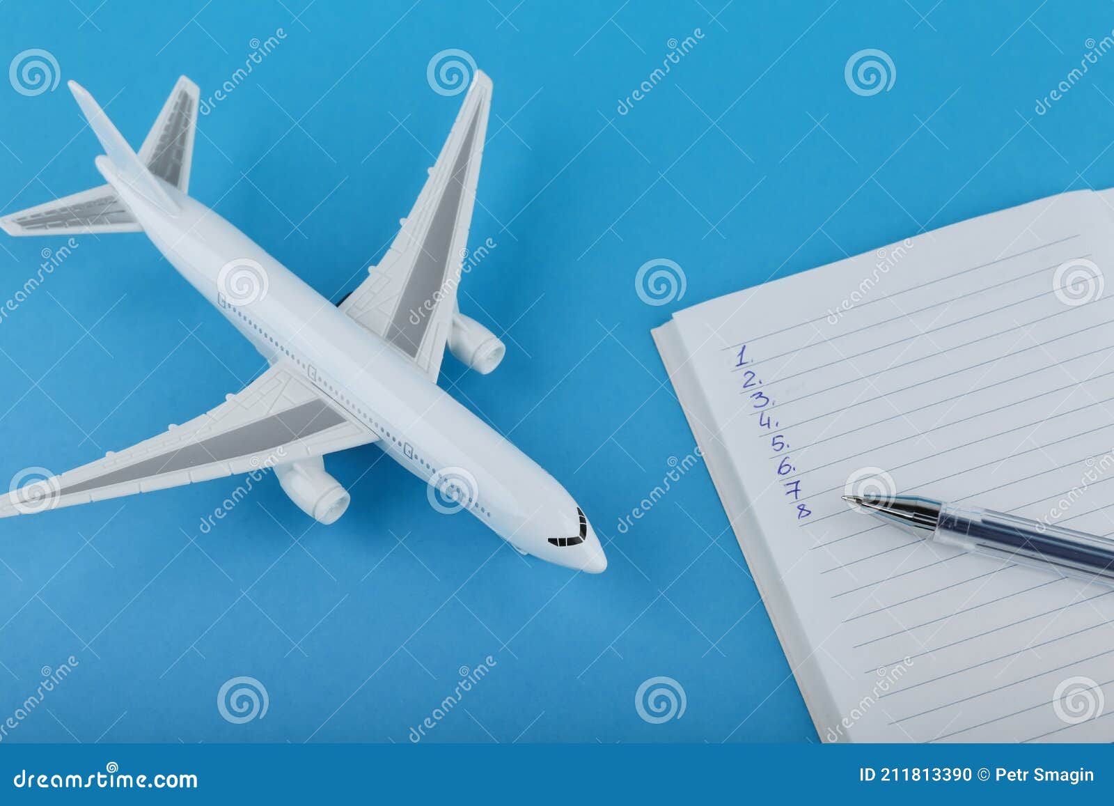 Flight Planning Concept. Plane, Diary and Pen on a Blue Background ...