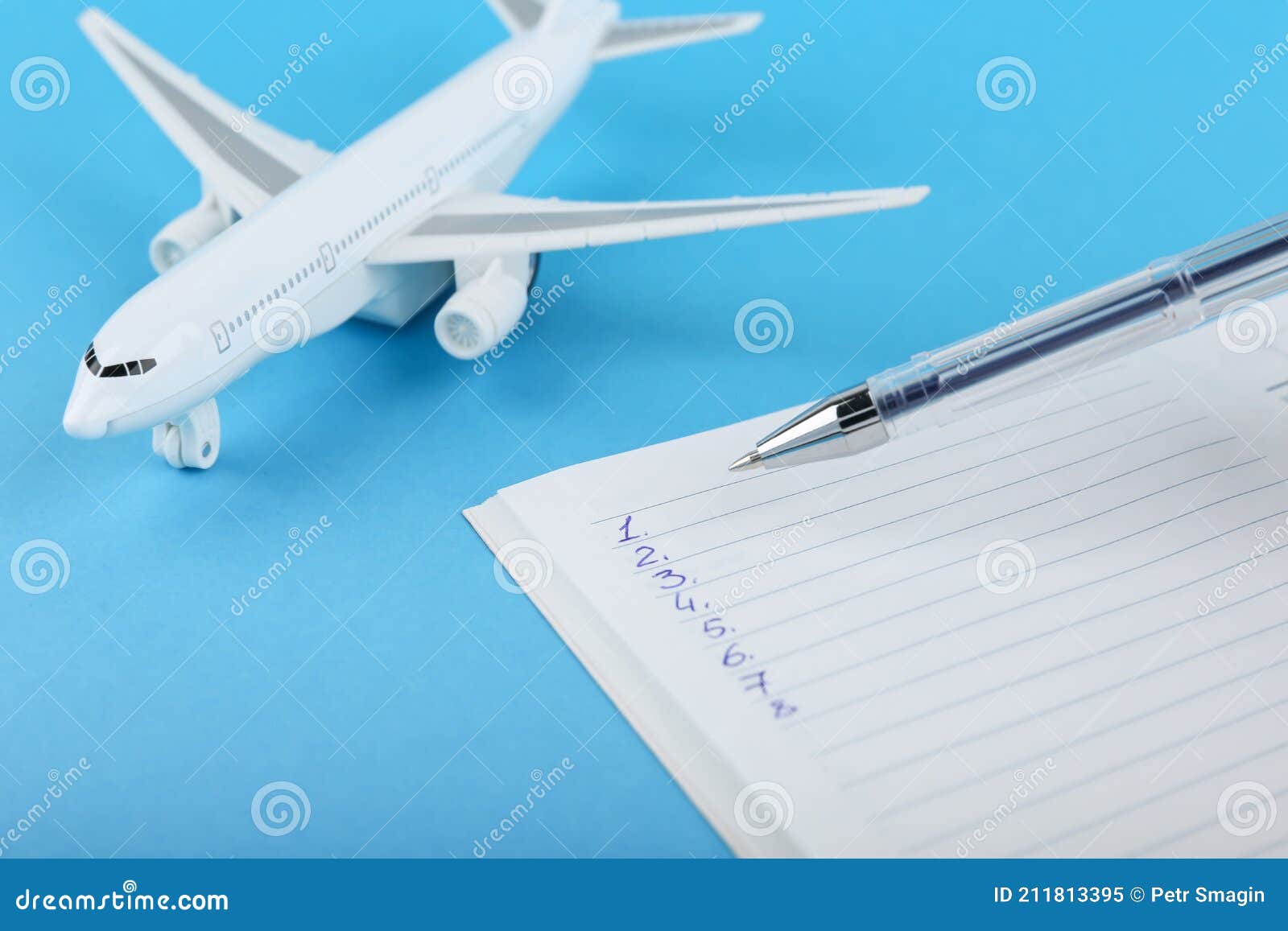 Flight Planning Concept. Plane, Diary and Pen on a Blue Background ...