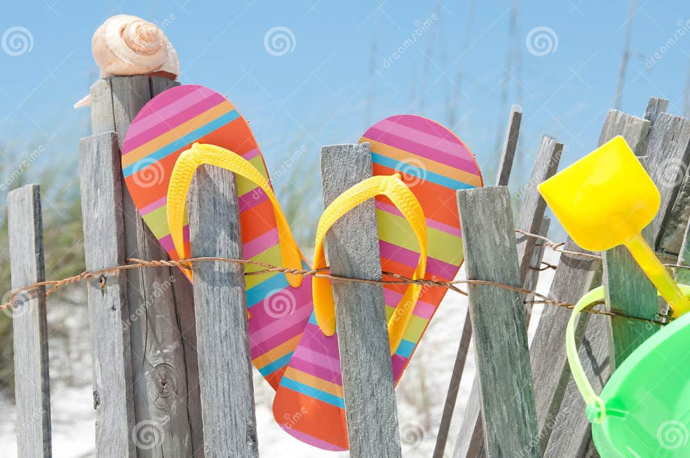 Flip flops on fence stock image. Image of cockel, summer - 19433915
