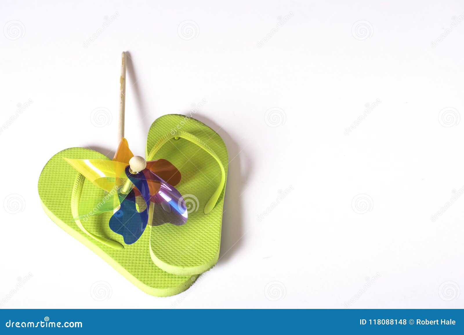 Flip Flops and Pin Wheel stock photo. Image of feet - 118088148