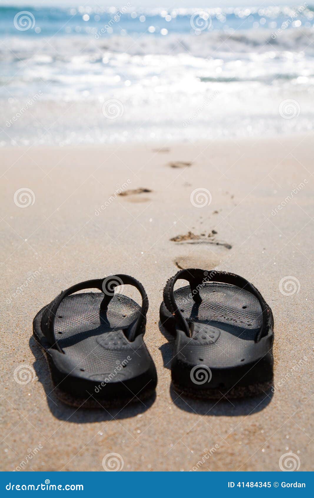 Flip flops on a sand beach stock image. Image of horizon - 41484345