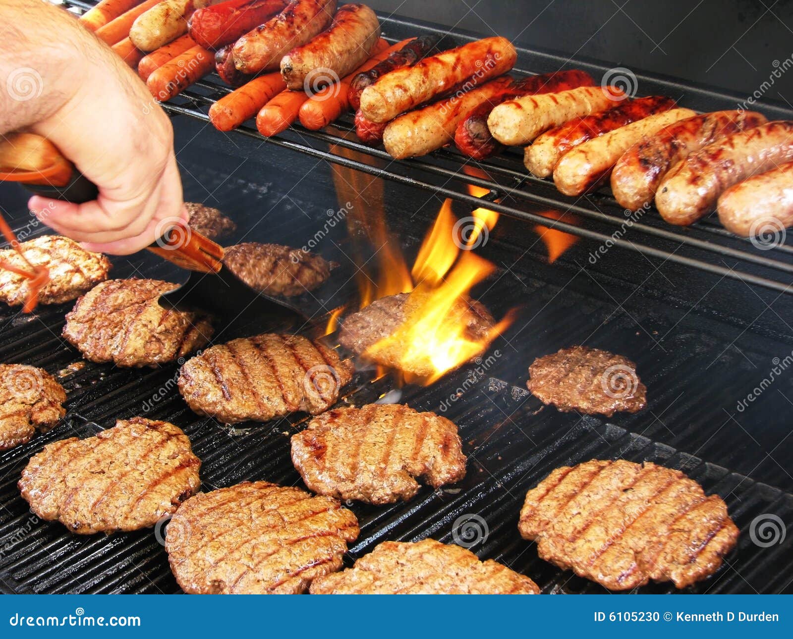 Flipping Hamburgers stock photo. Image of barbecue, brats - 6105230