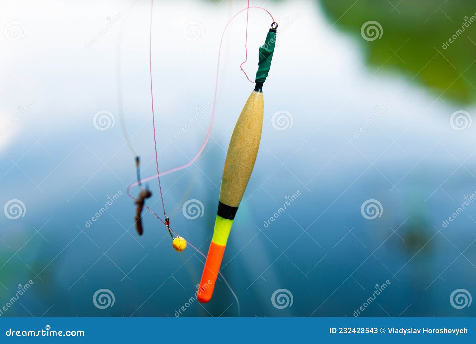 Float and Fishing Hooks with Bait Hanging on a Fishing Line Stock Image ...