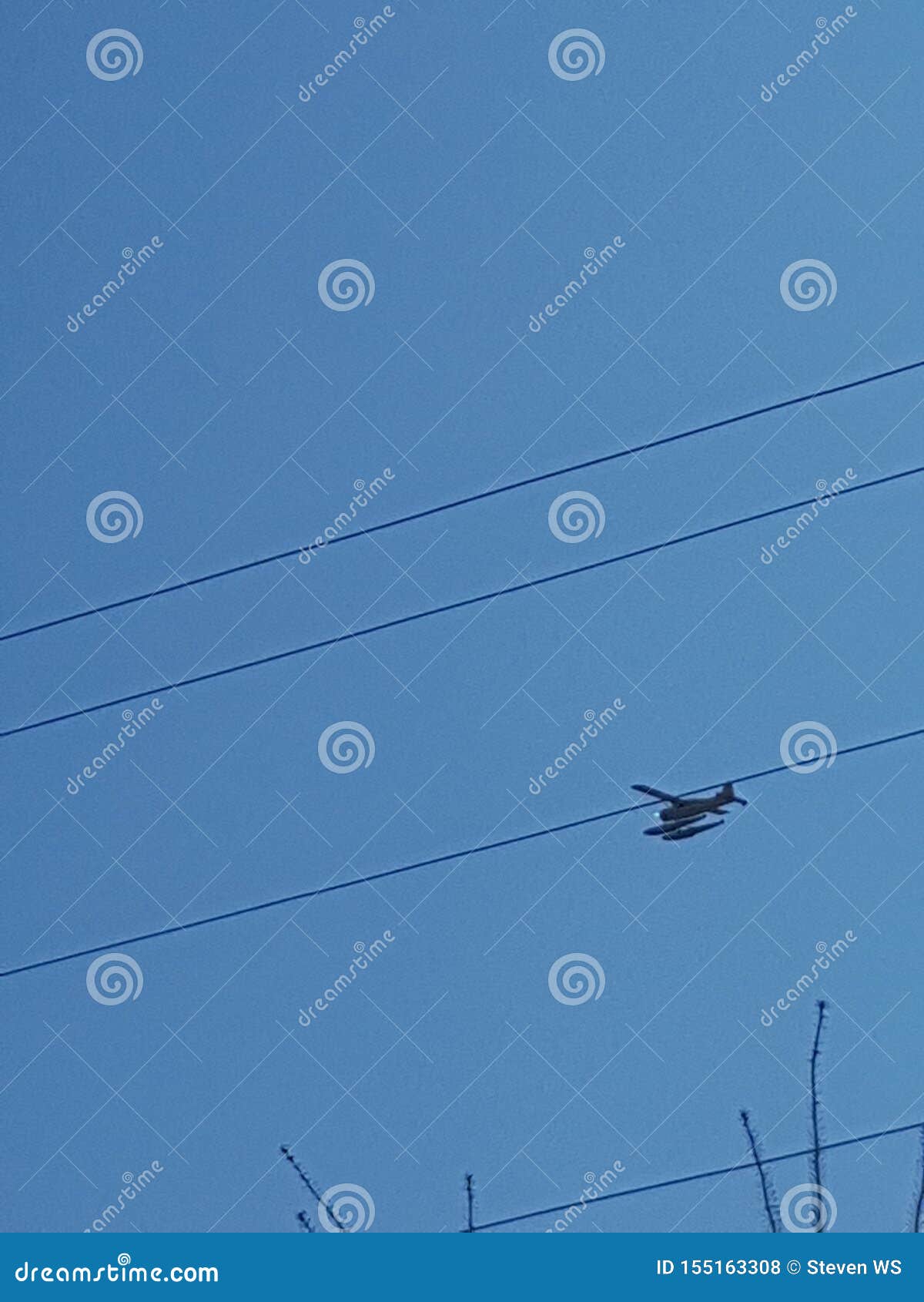 Float Plane Flying in Blue Sky Stock Photo - Image of flying, float ...