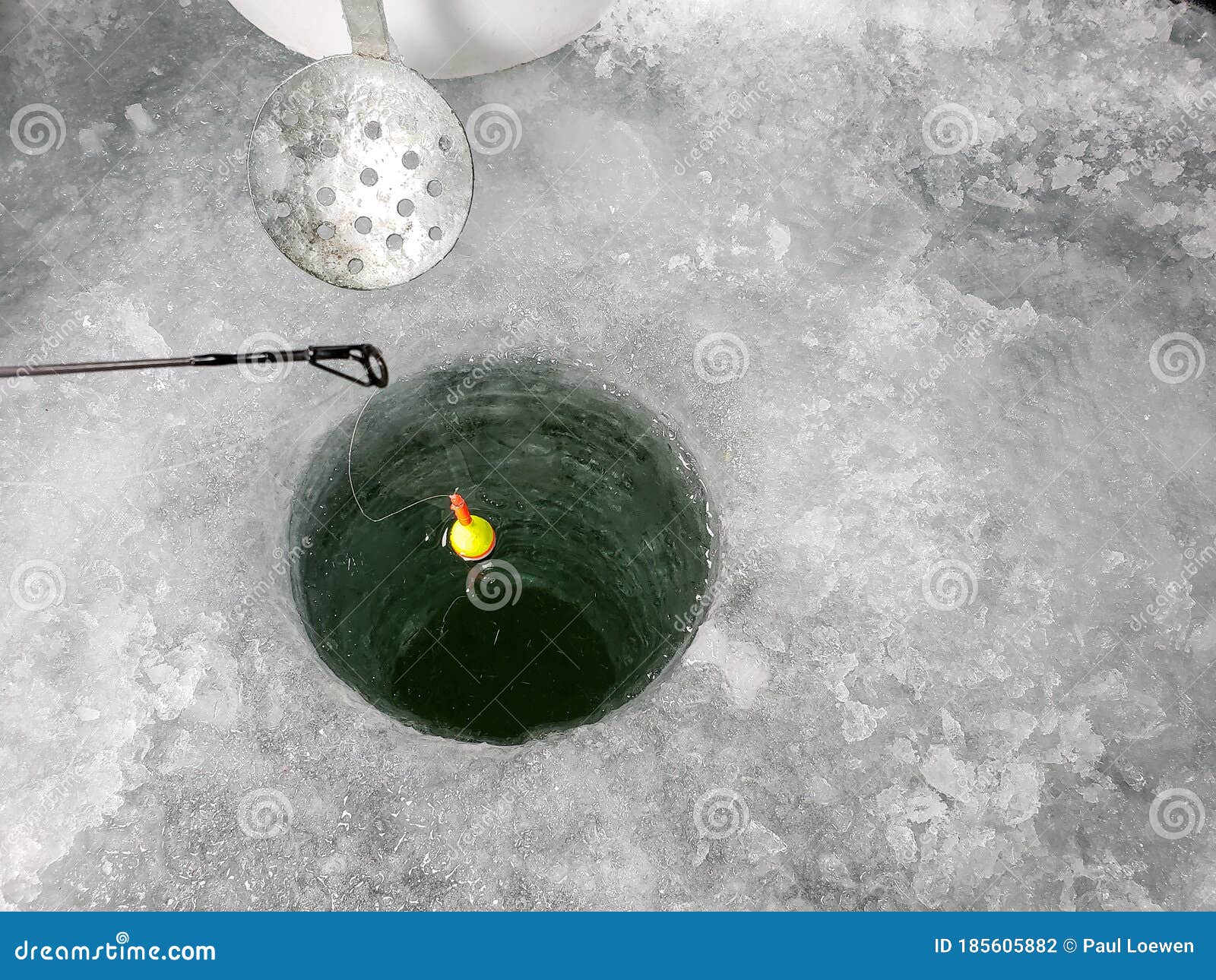A Float Sits in a an Ice Fishing Hole. Stock Photo - Image of glass ...
