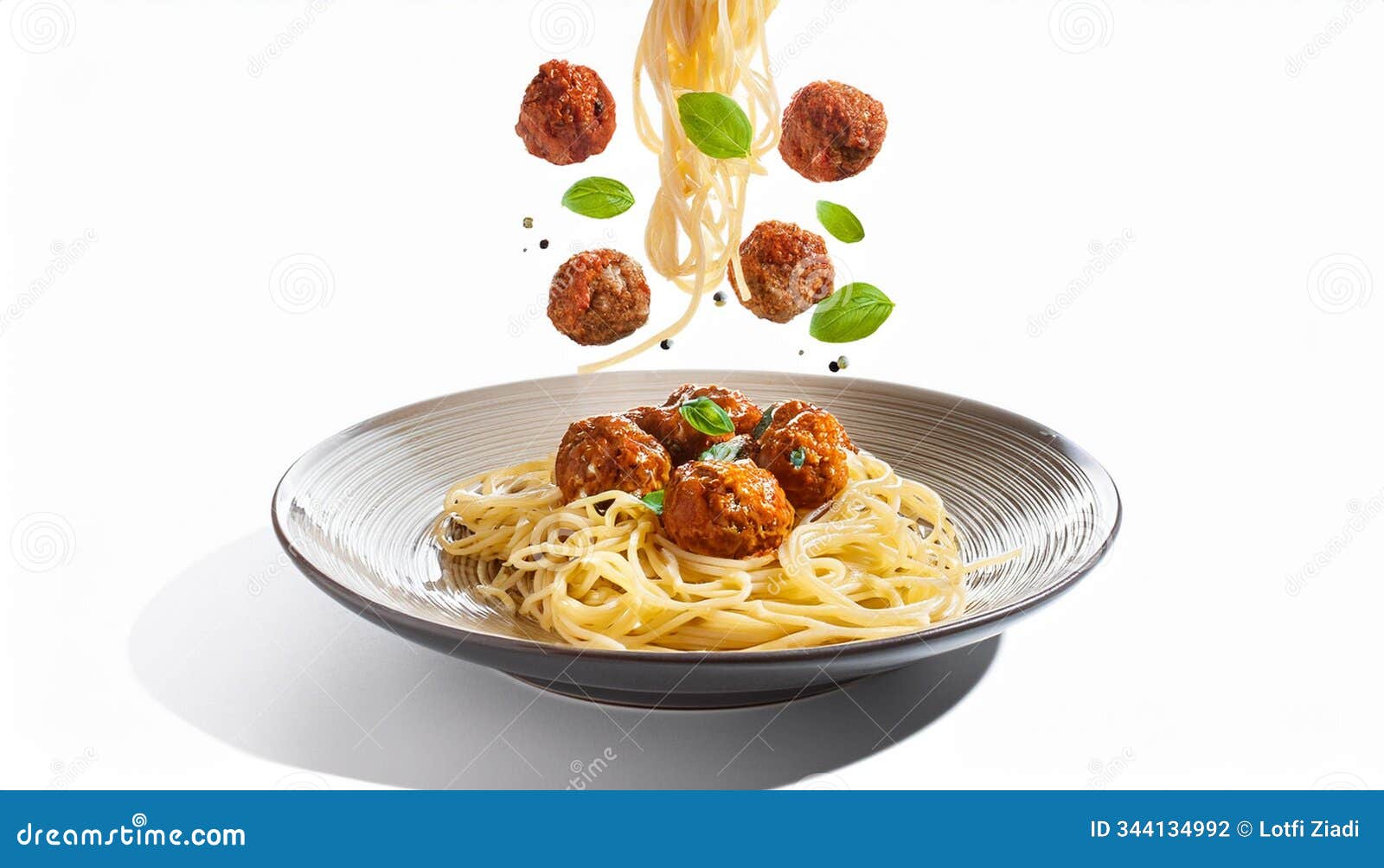 Floated Spaghetti Pasta with Meatballs Falling into a Plate Isolate on ...