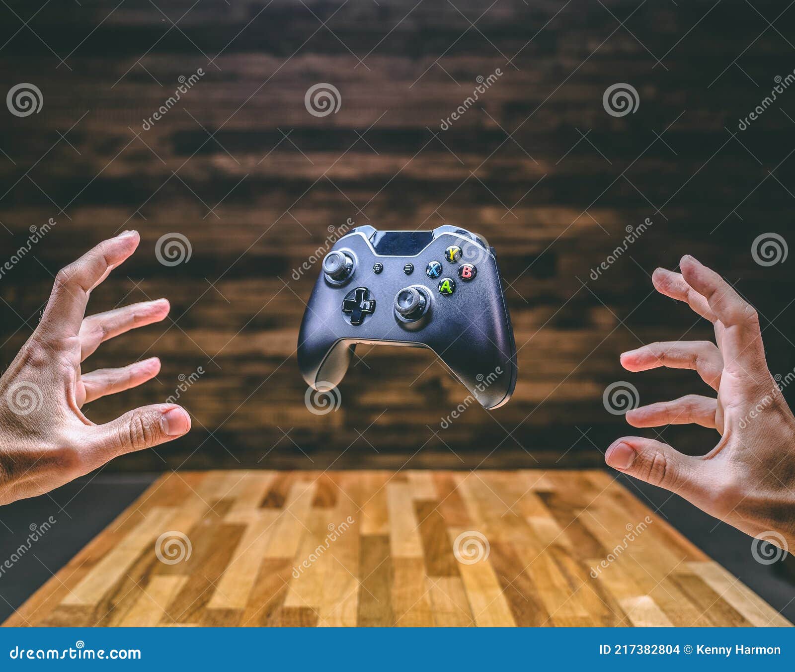 Floating Gaming Controller Over Table Stock Photo - Image of technology ...
