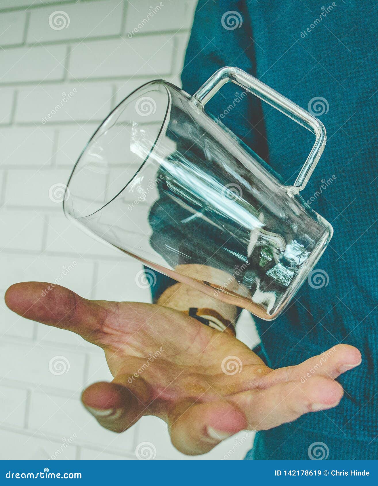 Floating glass over hand stock image. Image of minimalism - 142178619