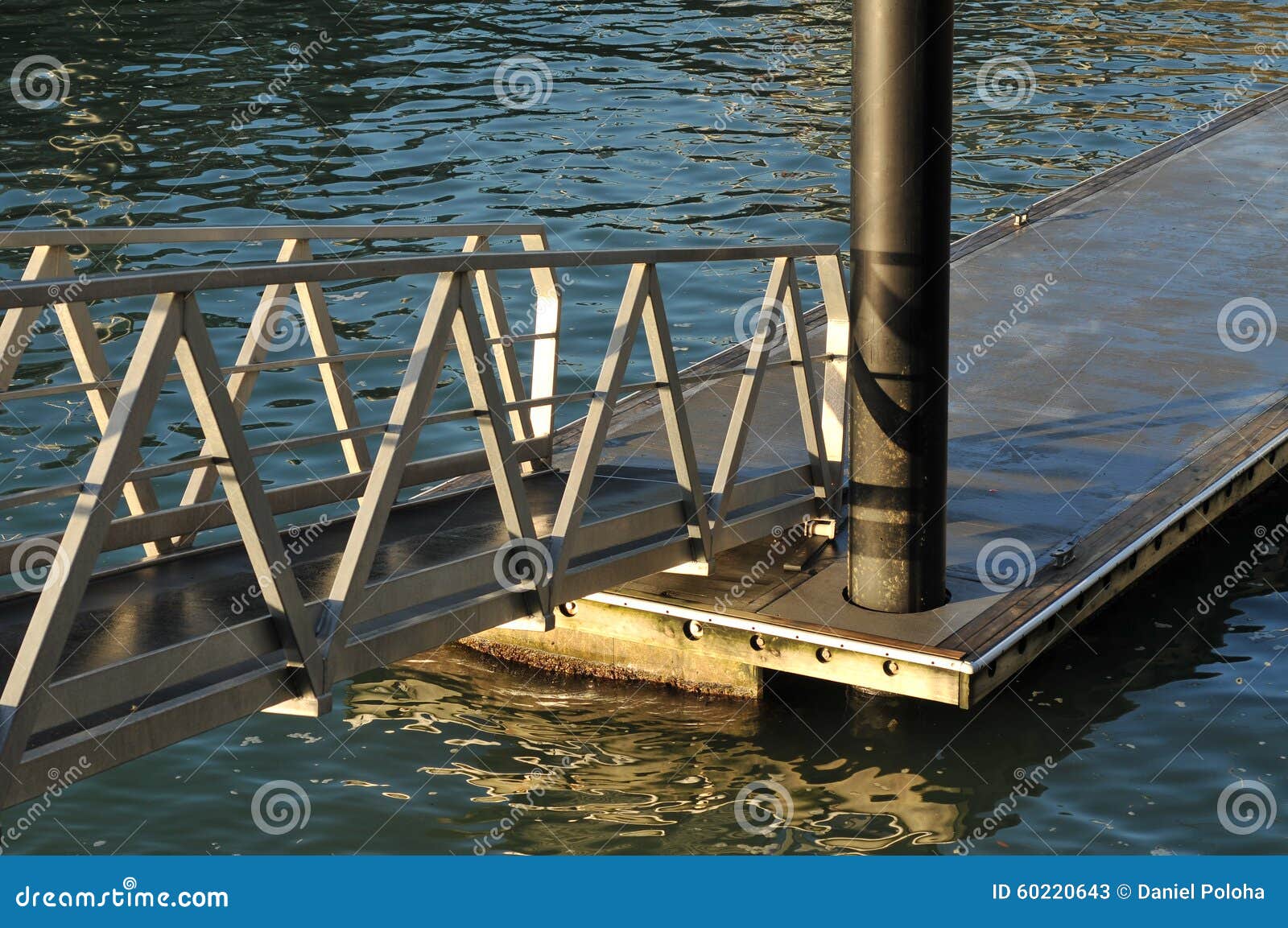 A Floating Jetty For Mooring Ships Is Fixed With Metal Rods On Hinges ...