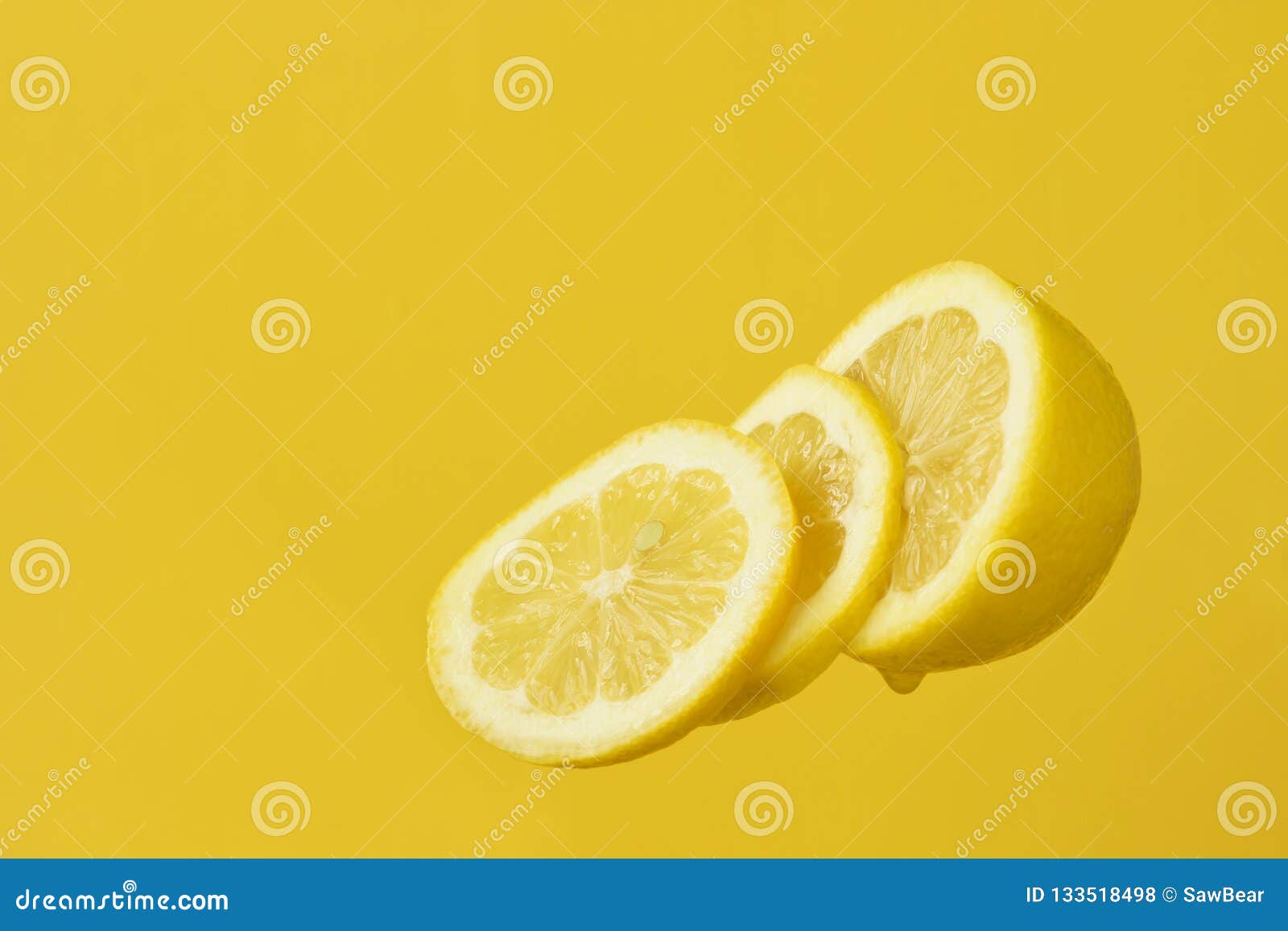 Floating Lemon Slices on Yellow Stock Photo - Image of floating ...