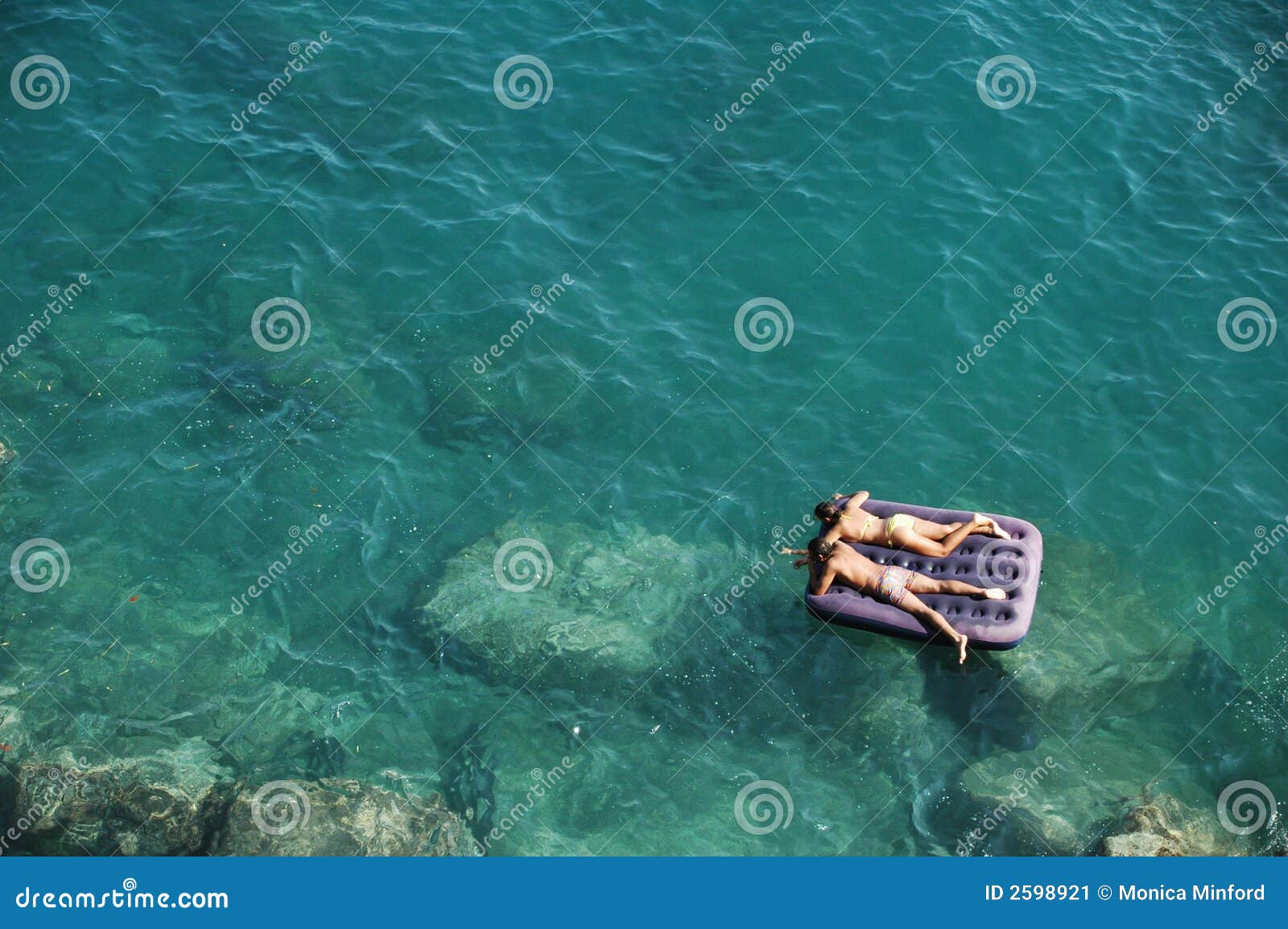 Floating in the Sea stock image. Image of bathe, rocks - 2598921