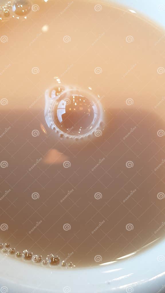 A Floating Tea Bubble on a Cup of Tea Stock Photo - Image of circle ...
