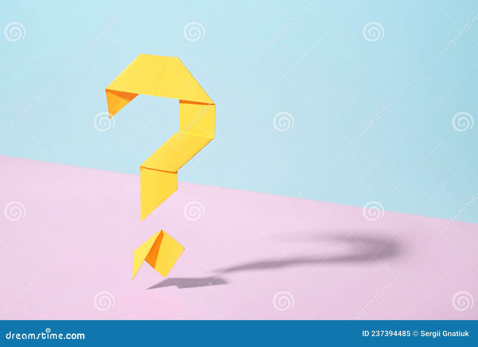Floating Yellow Origami Question Mark On Bicolor Background Royalty ...