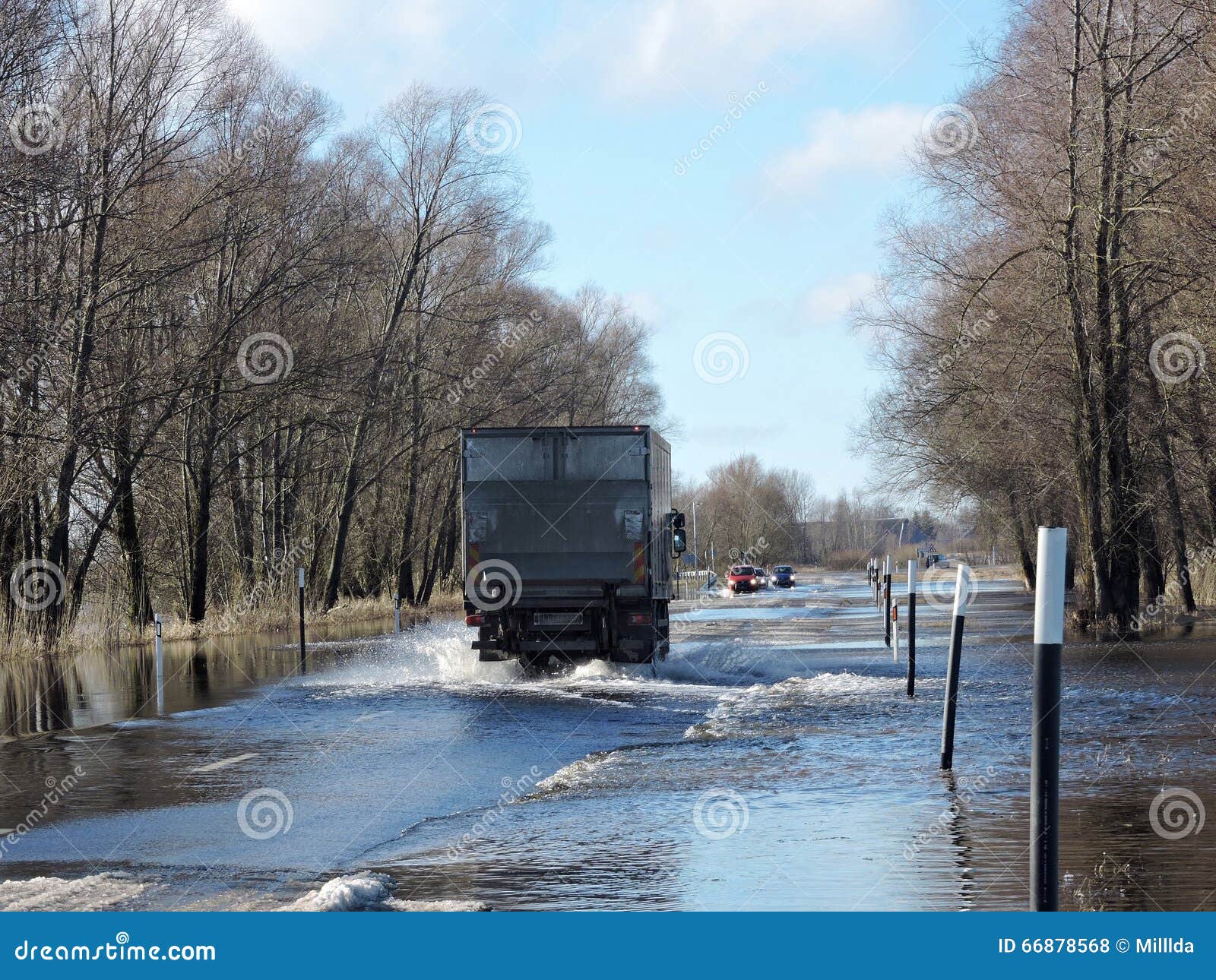 Flood on road in Lithuania stock photo. Image of move - 66878568