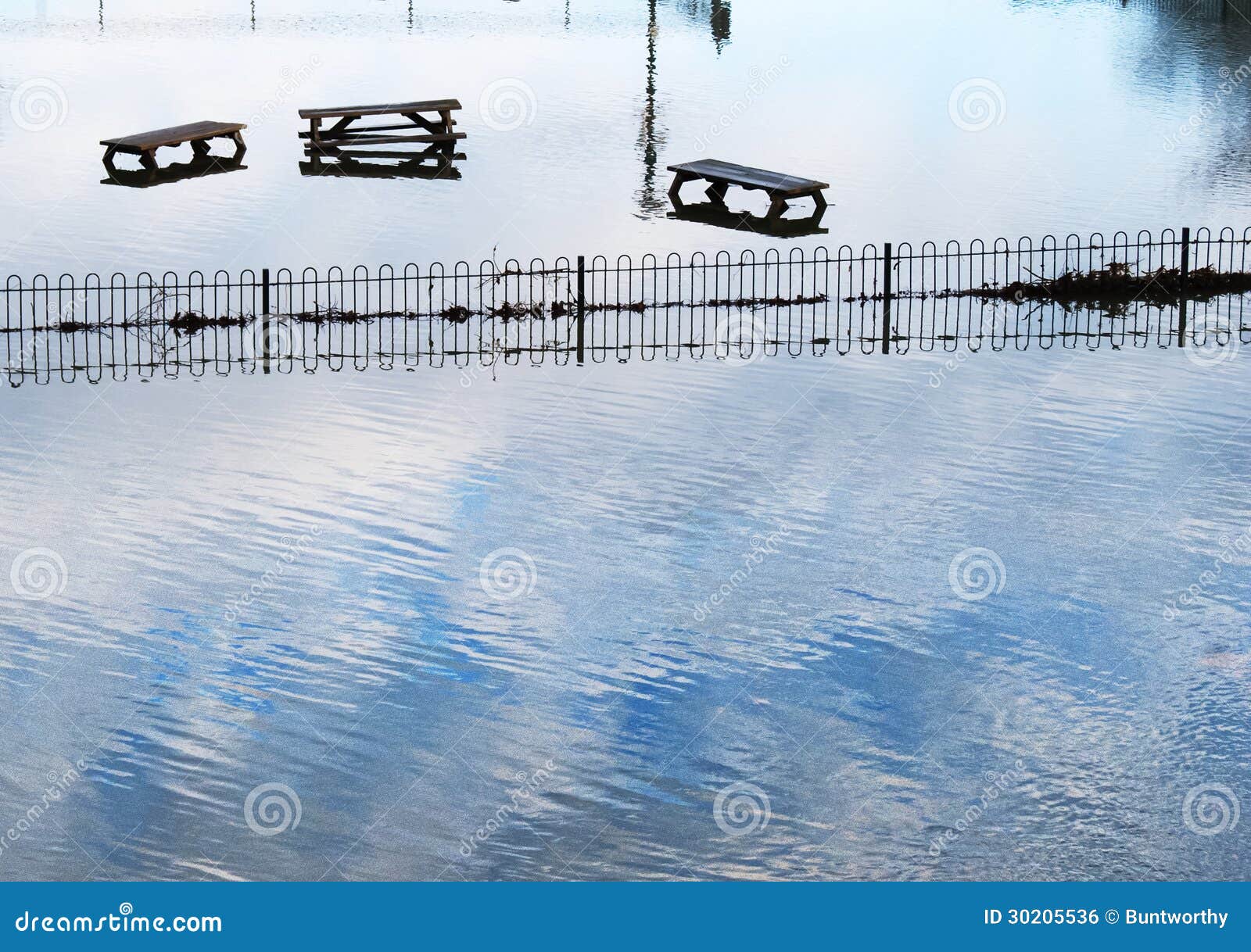 Three flooded park benches stock photo. Image of water - 30205536
