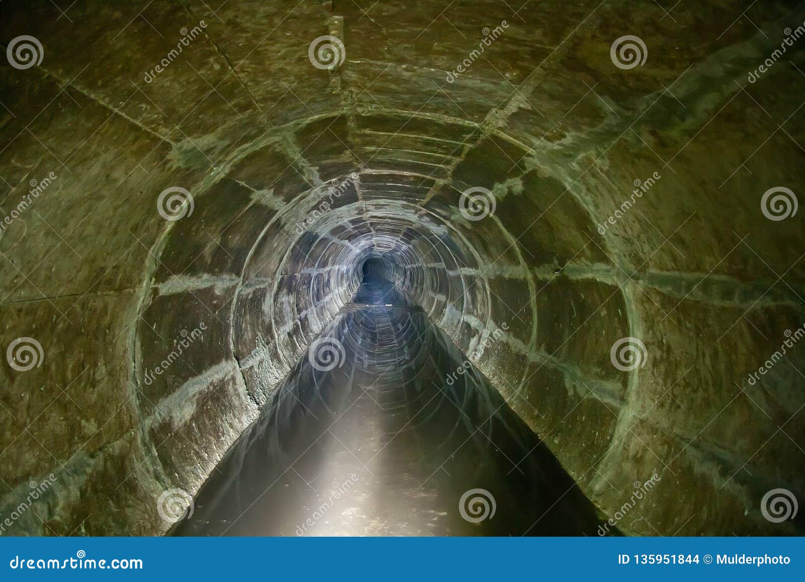 Flooded Round Sewer Tunnel is Reflecting in Water Stock Photo - Image ...