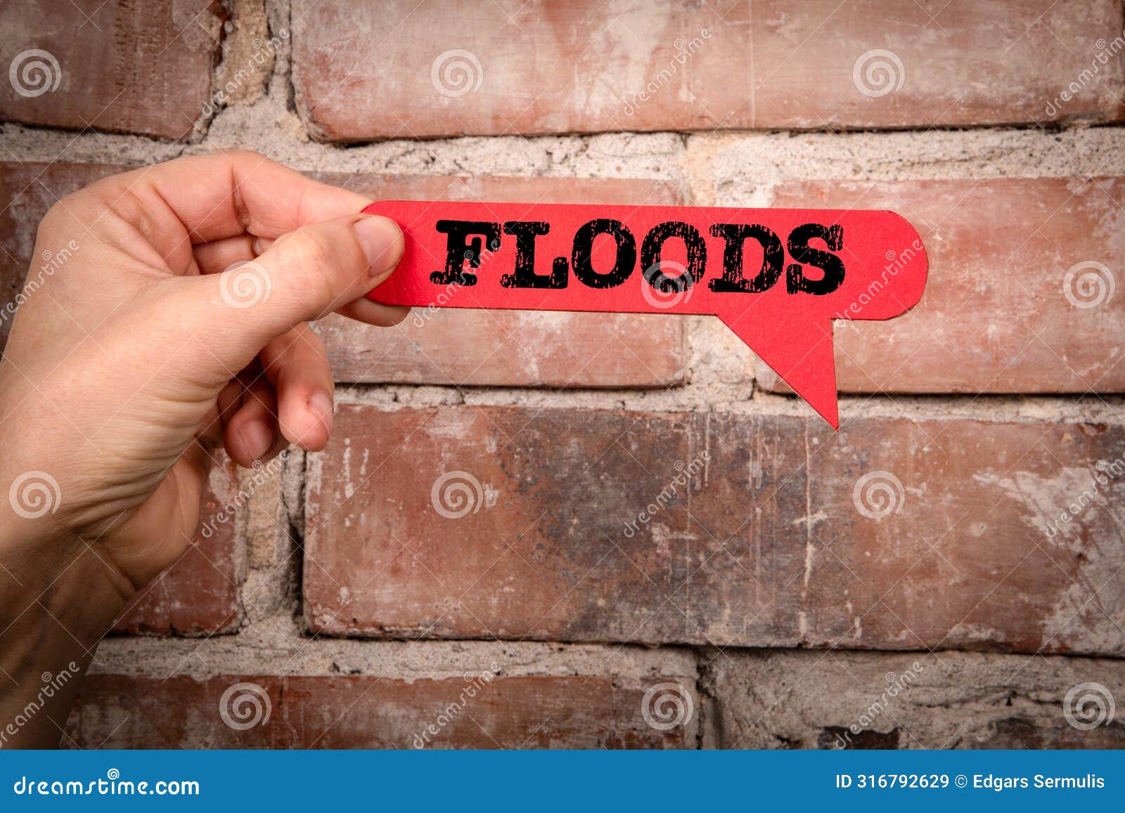 FLOODS. Red Speech Bubble with Text on a Red Brick Background Stock ...