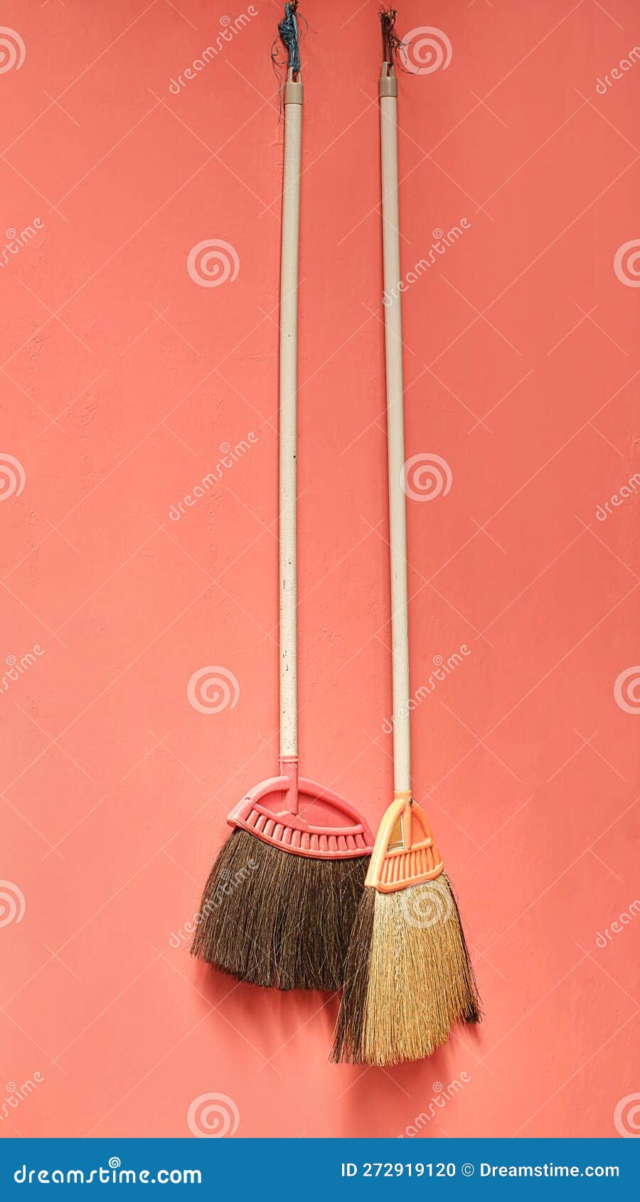 The Floor Brooms Hanging on a Pink Wall Stock Photo - Image of hygiene ...