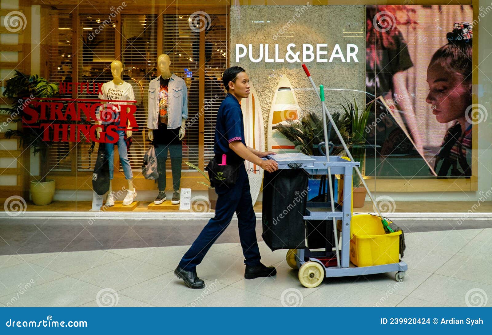 A Floor Cleaner in the Mall, in Front of the Pull & Bear Shop, Bandung ...