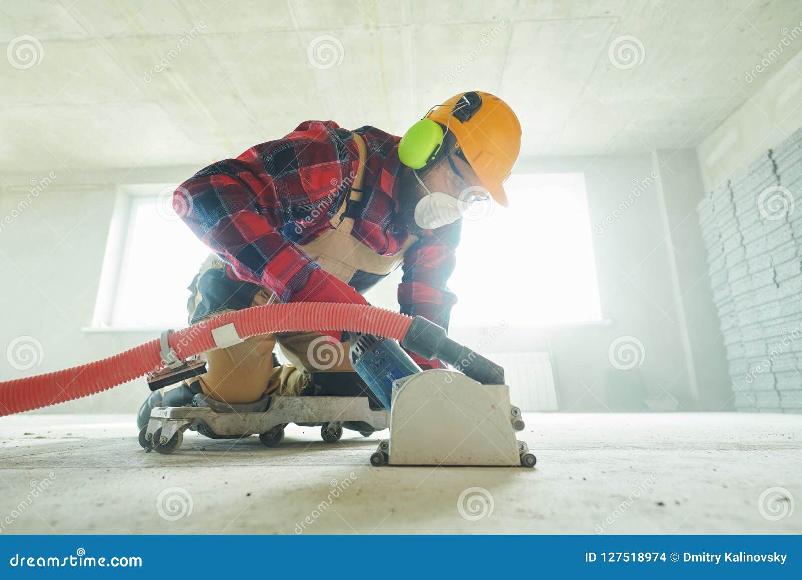 Builder at Work. Cutting Concrete Floor for Cabling by Diamond Slitting ...