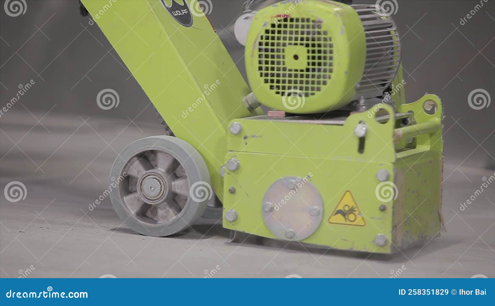 Floor Grinding at a Construction Site. a Builder Works with an ...