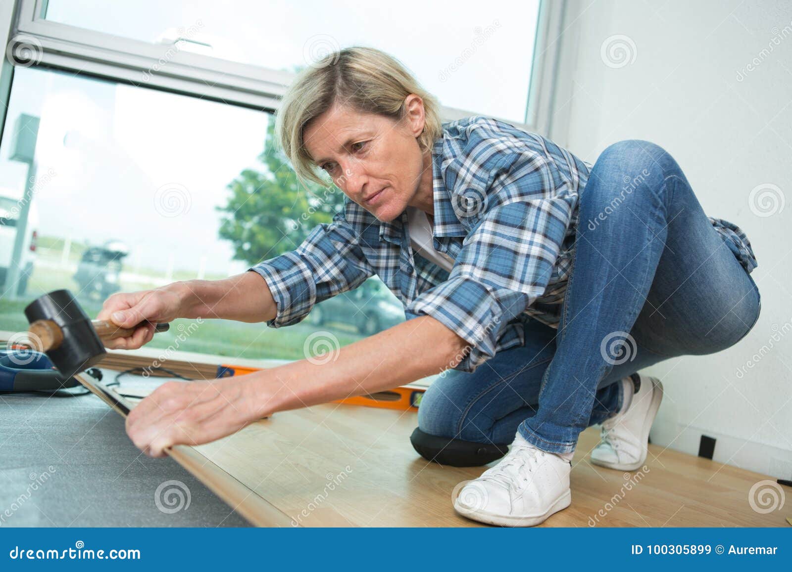 Floor installer doing job stock image. Image of contractor - 100305899