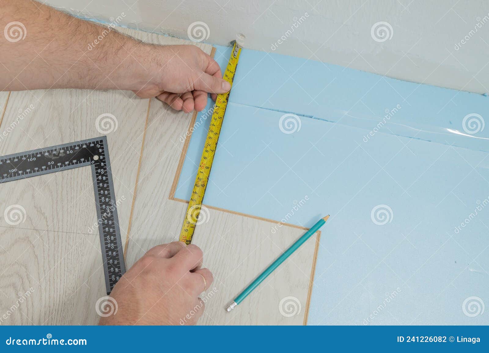 Floor Renovation. Measuring before Setting of the Laminate Floor Stock ...