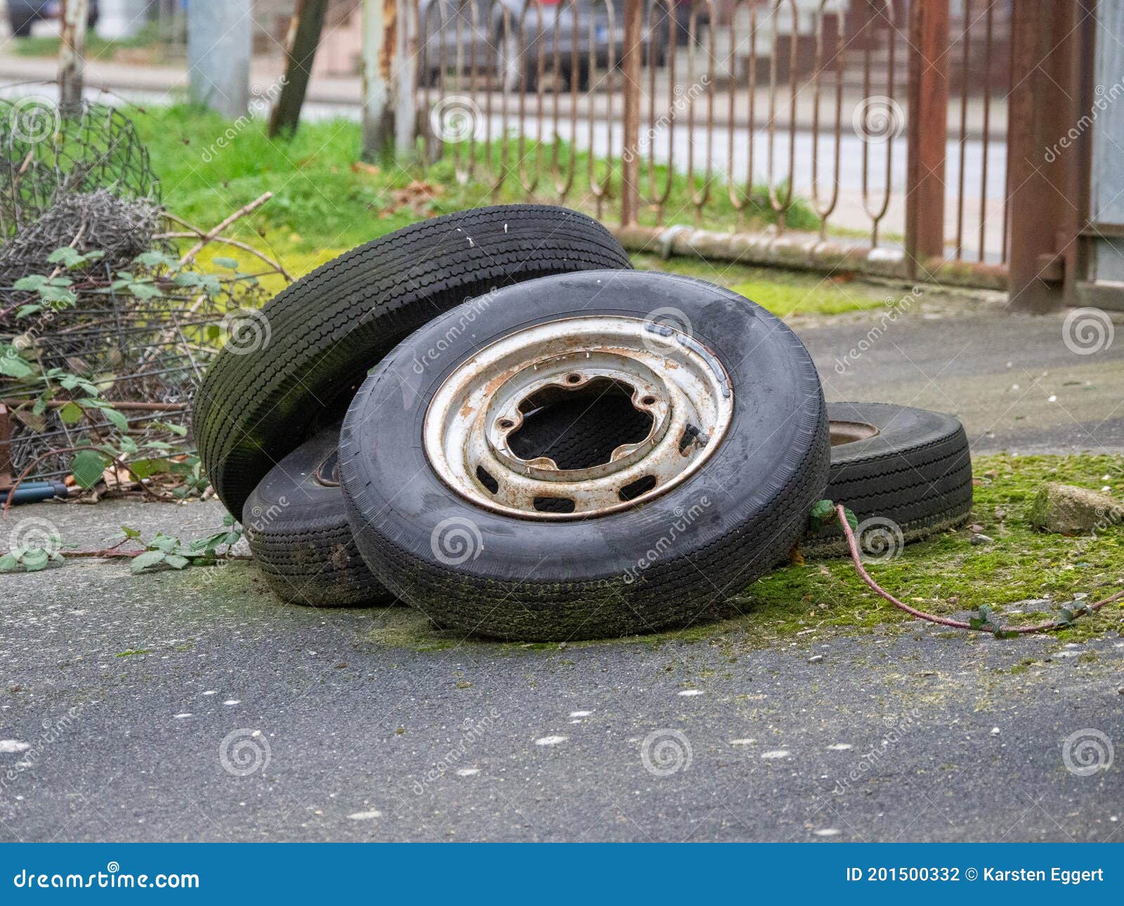 On a Floor are Some Old Car Wheels with Rusty Rims Stock Photo - Image ...
