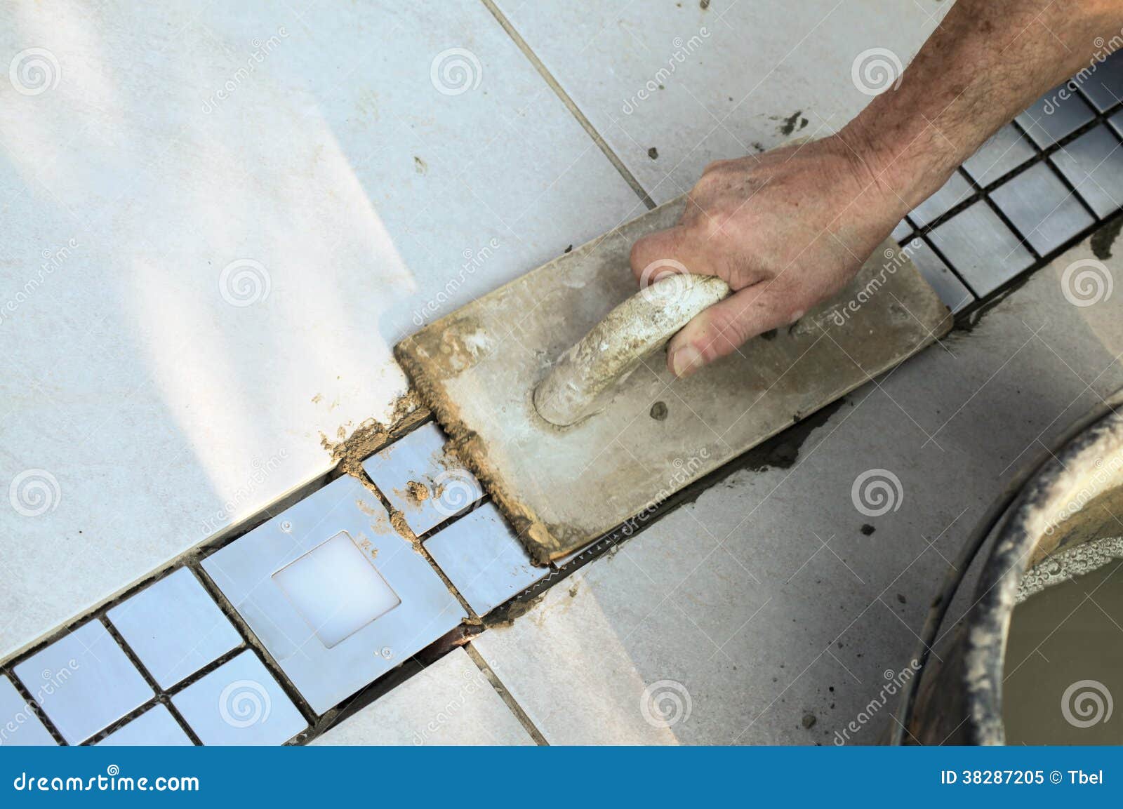 Floor tiler at work 2 stock image. Image of installation - 38287205