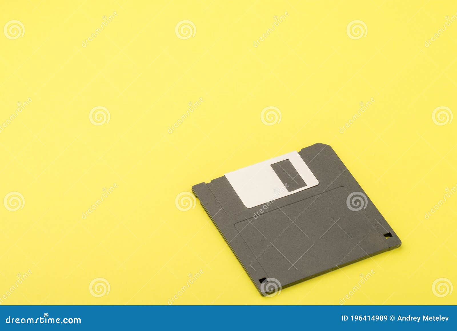 Floppy Disk on a Yellow Paper Background Stock Image - Image of ...