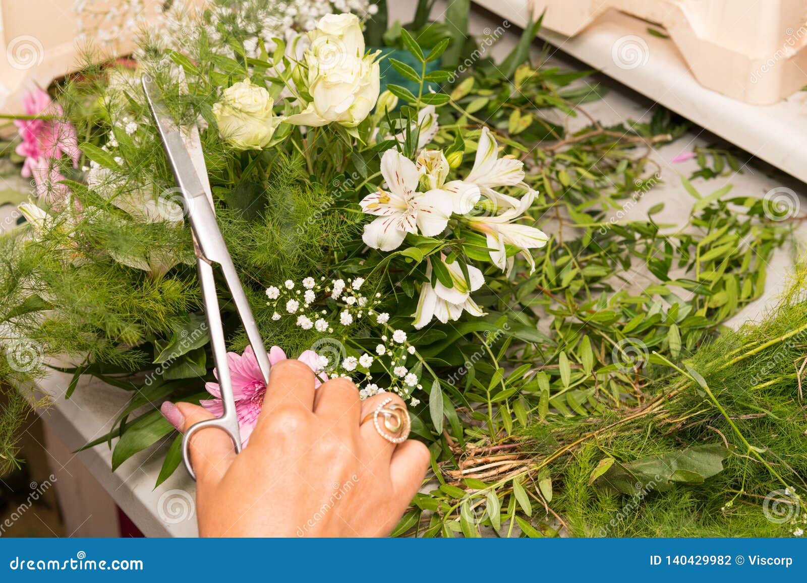 Florist at Work stock photo. Image of bouquet, beauty - 140429982