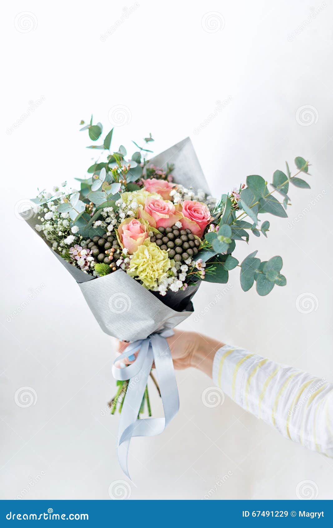Florist Hands Showing Bouquet of Spring Flowers. Selective Focus. Stock ...