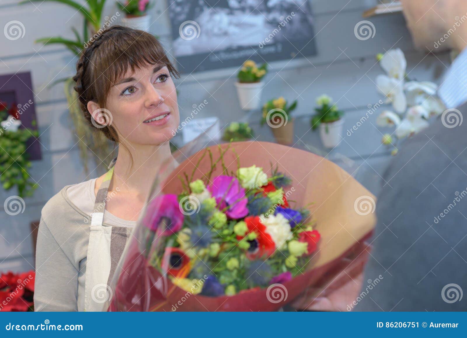 Florist Passing Bouquet Flowers To Client Stock Image - Image of sale ...