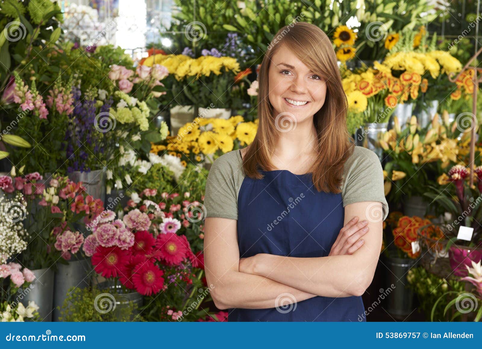 Florist Standing in Shop in Front of Flower Display Stock Image - Image ...