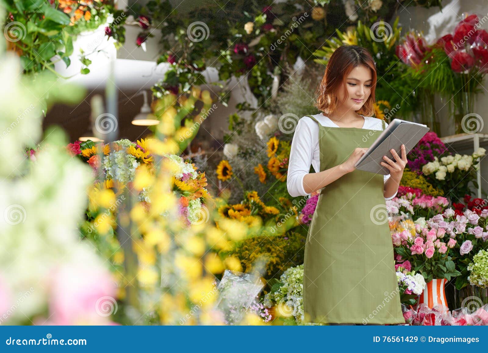 Florist with tablet stock image. Image of tablet, occupation - 76561429