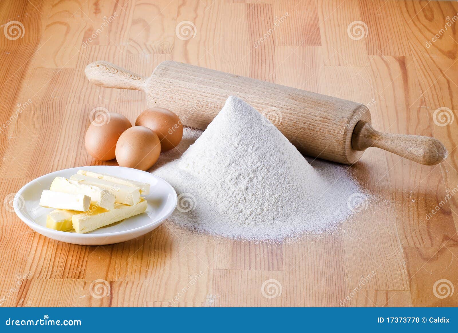 Flour with Eggs, Rolling Pin and Butter Stock Photo - Image of pile ...