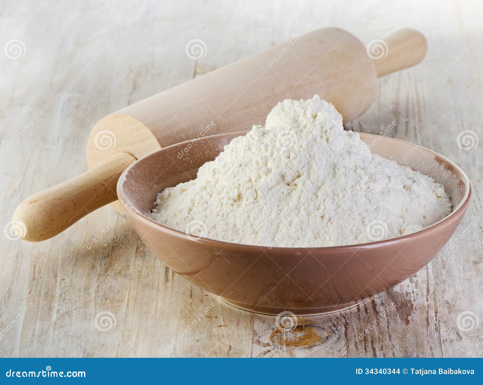 Flour on a wooden table stock photo. Image of bowl, utensil - 34340344