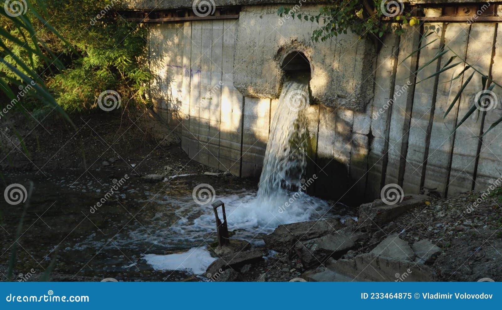 The Flow of Sewage Water Falls into the River from a Pipe in a Concrete ...