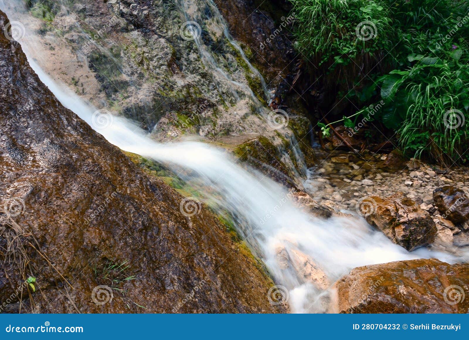 The Flow of a Small Waterfall on the Rock Flows Over the Stones ...