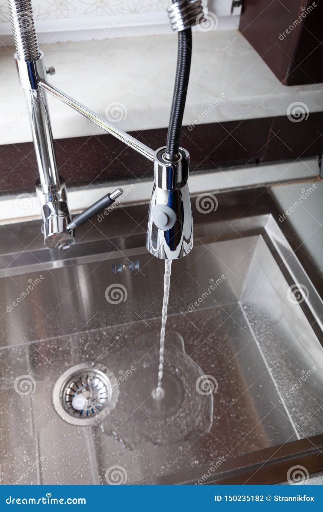 Flow of Water in a Metal Sink on a Modern Kitchen Stock Photo - Image ...