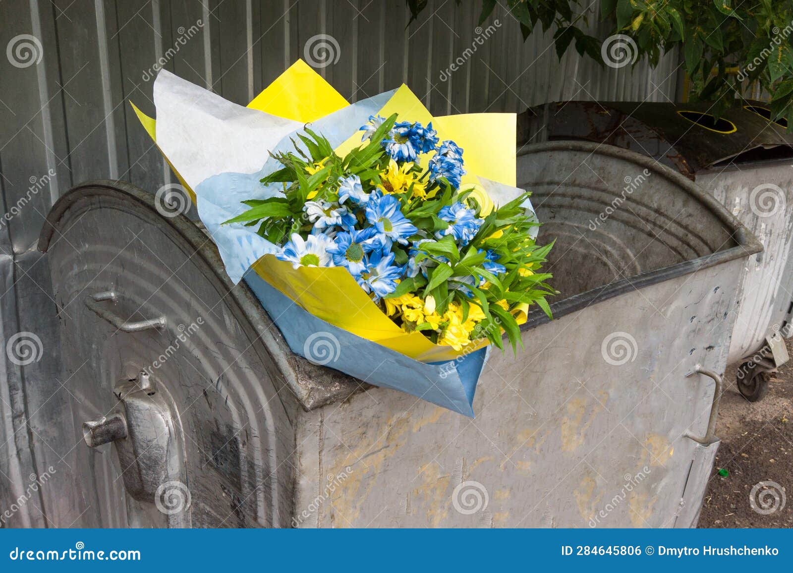 A Flower Bouquet Thrown in Trash Container. Flowers Bouquet at Garbage ...