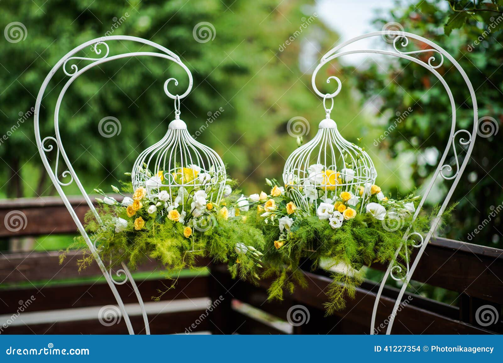 Flower bouquets in cages stock photo. Image of head, birdcage - 41227354