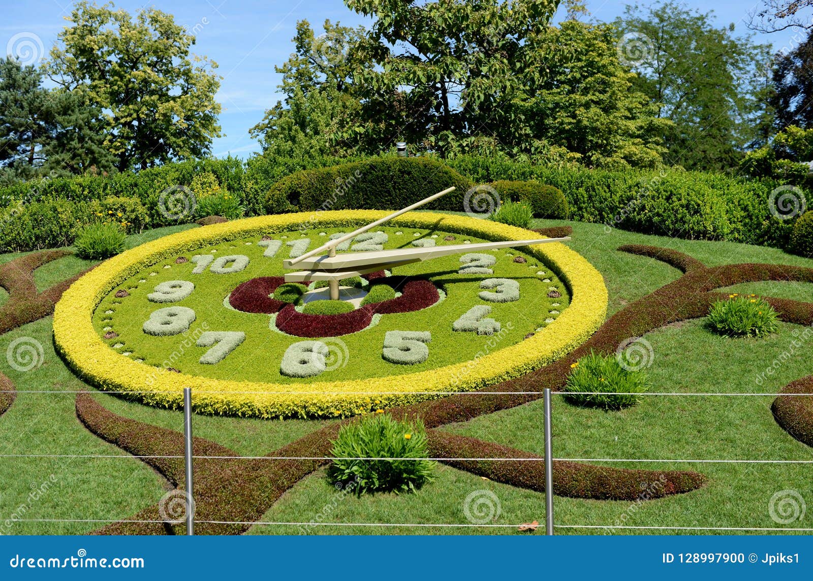 Flower clock stock photo. Image of flowerbed, lawn, garden - 128997900