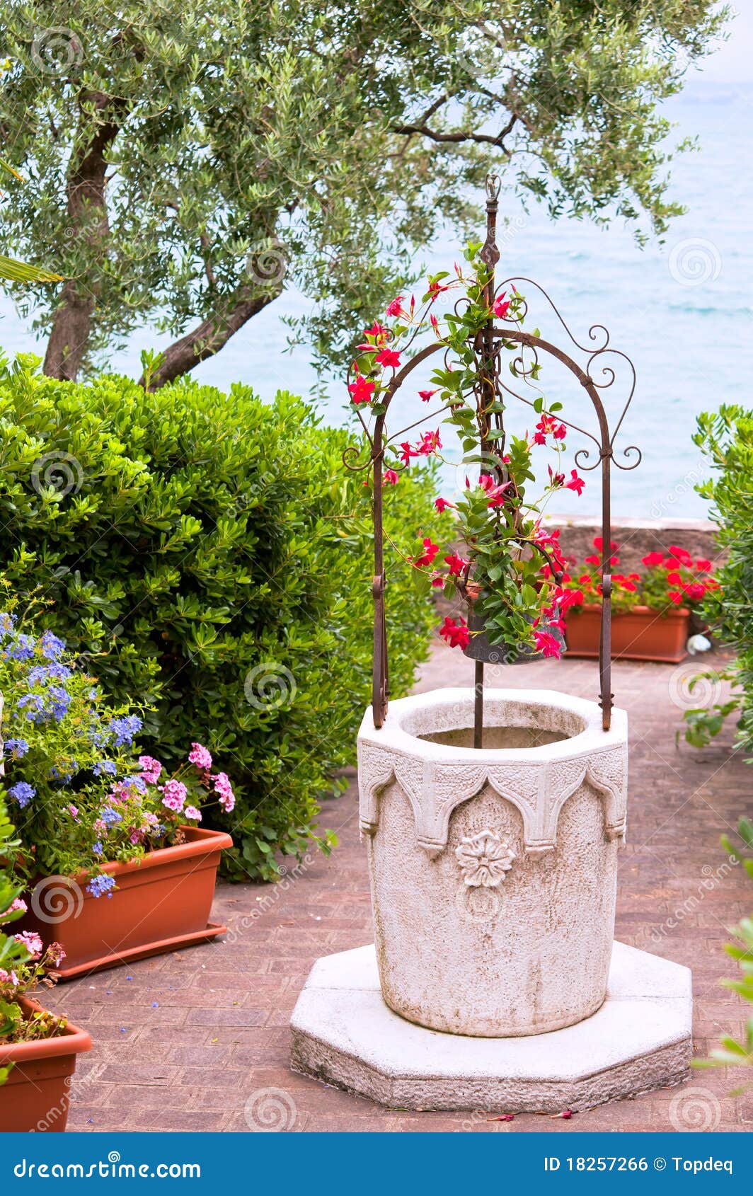 Flower Garden with Stone Well Stock Photo - Image of pink, blooming ...