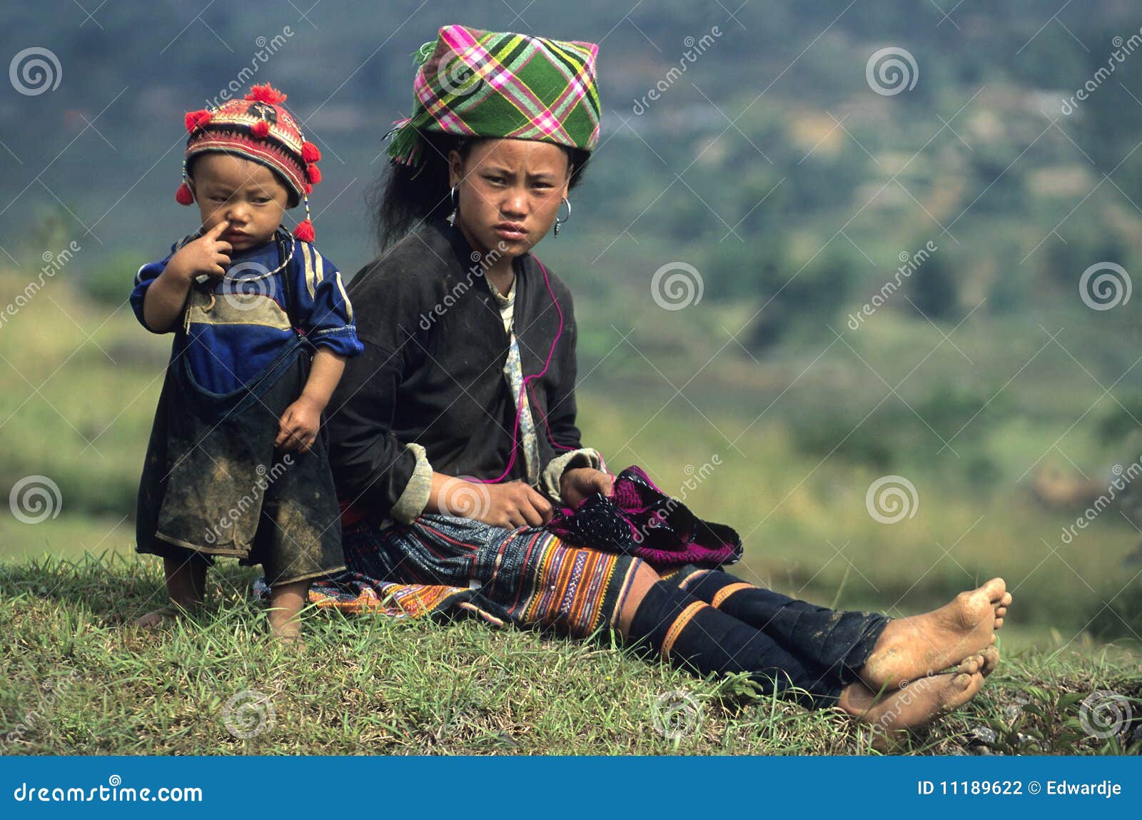 Hmong Child Eating Candy On The Dirty Ground In Van Rocky Plateau ...