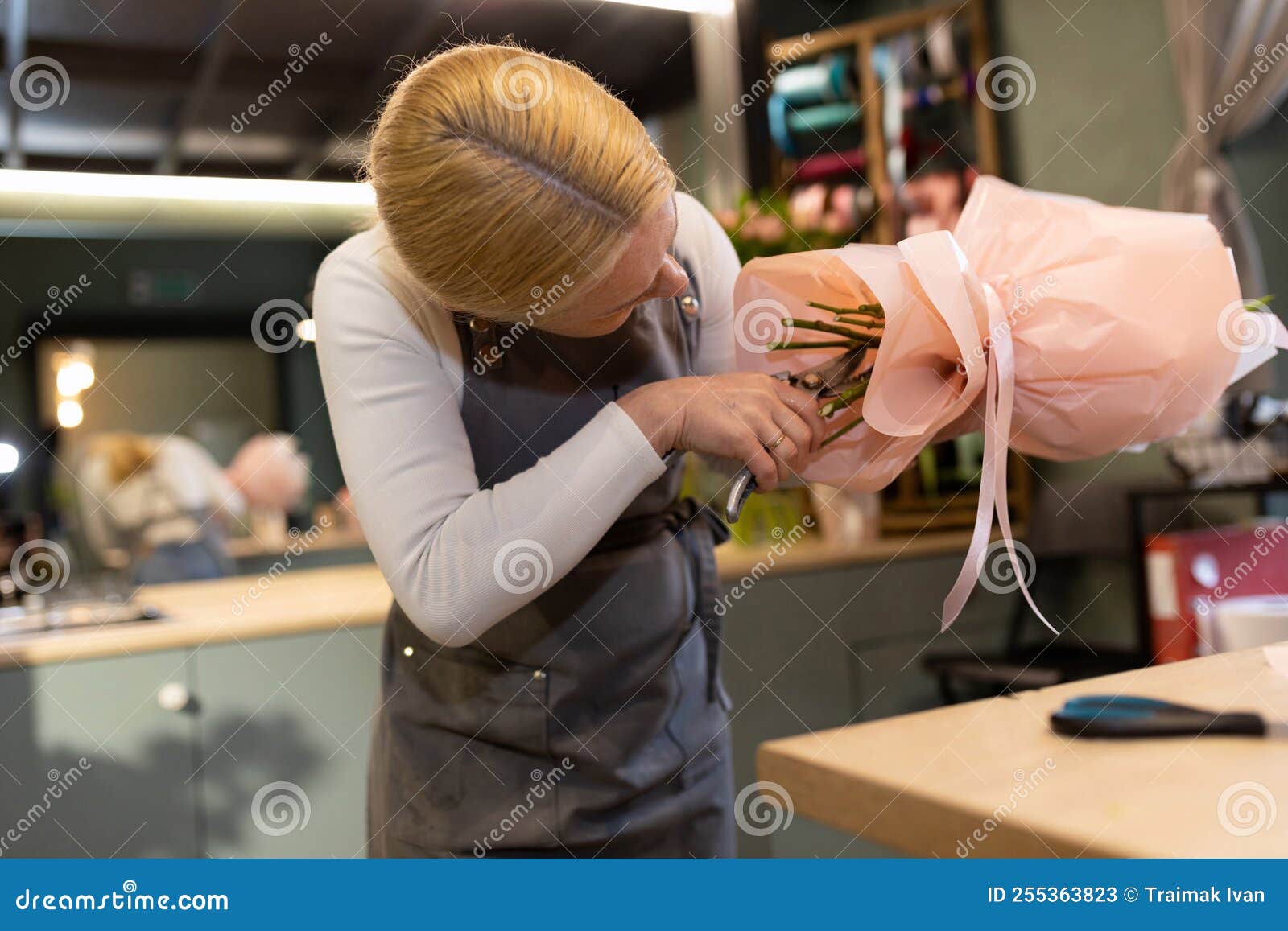Flower Packing Manager Packs a Bouquet in Gift Paper Stock Image ...
