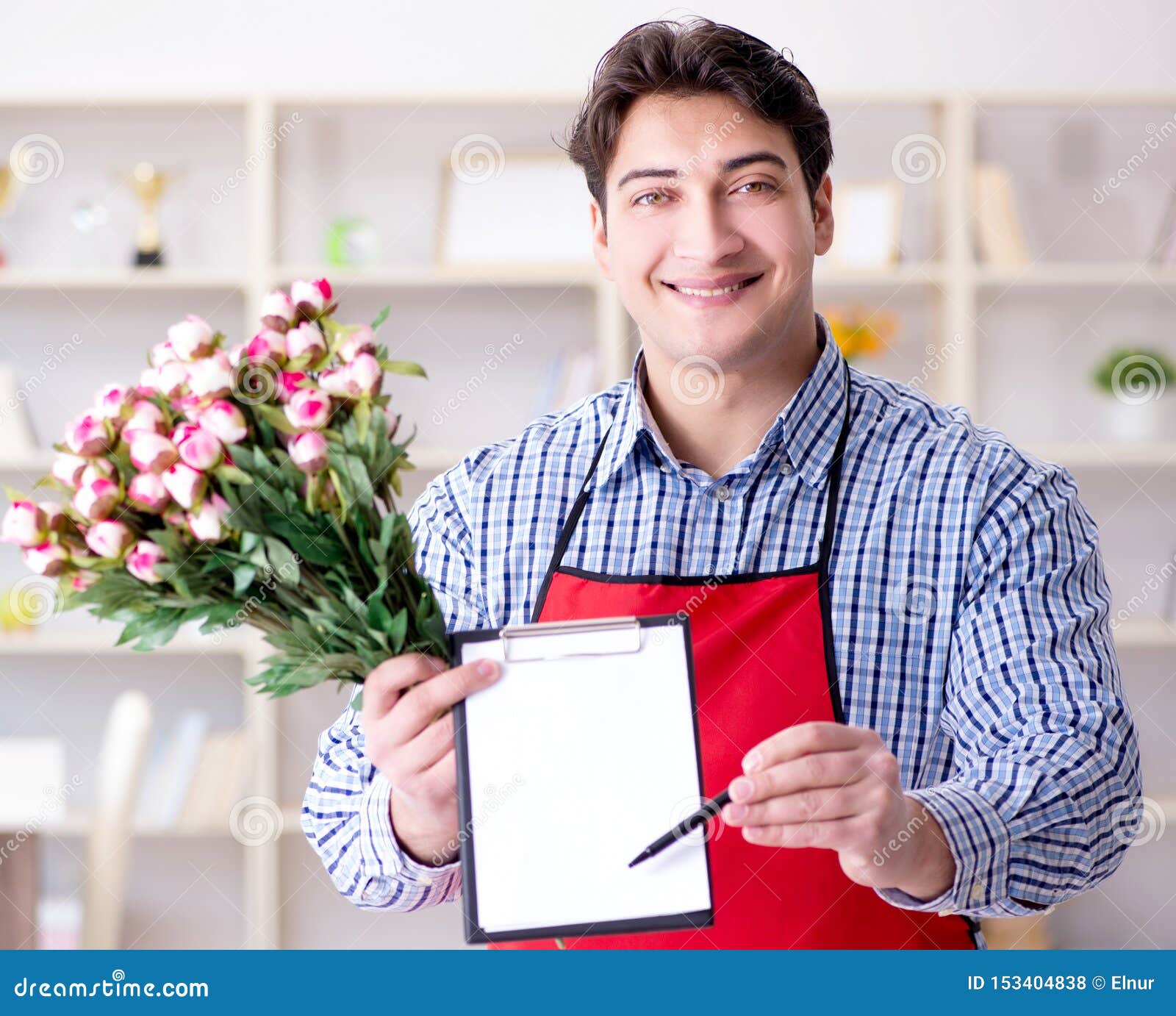 Flower Shop Assistant Offering a Bunch of Flowers Stock Photo - Image ...