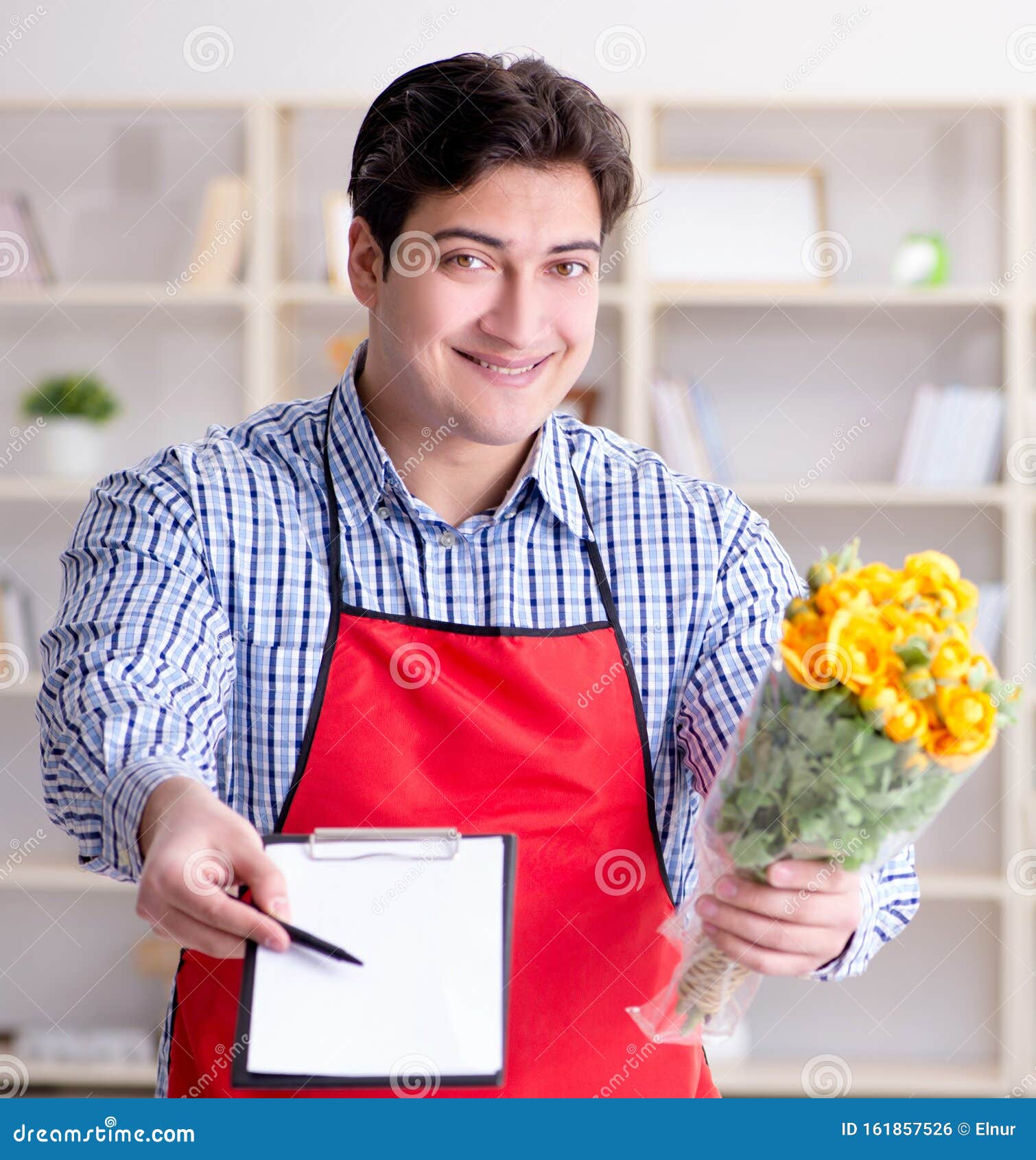The Flower Shop Assistant Offering a Bunch of Flowers Stock Photo ...