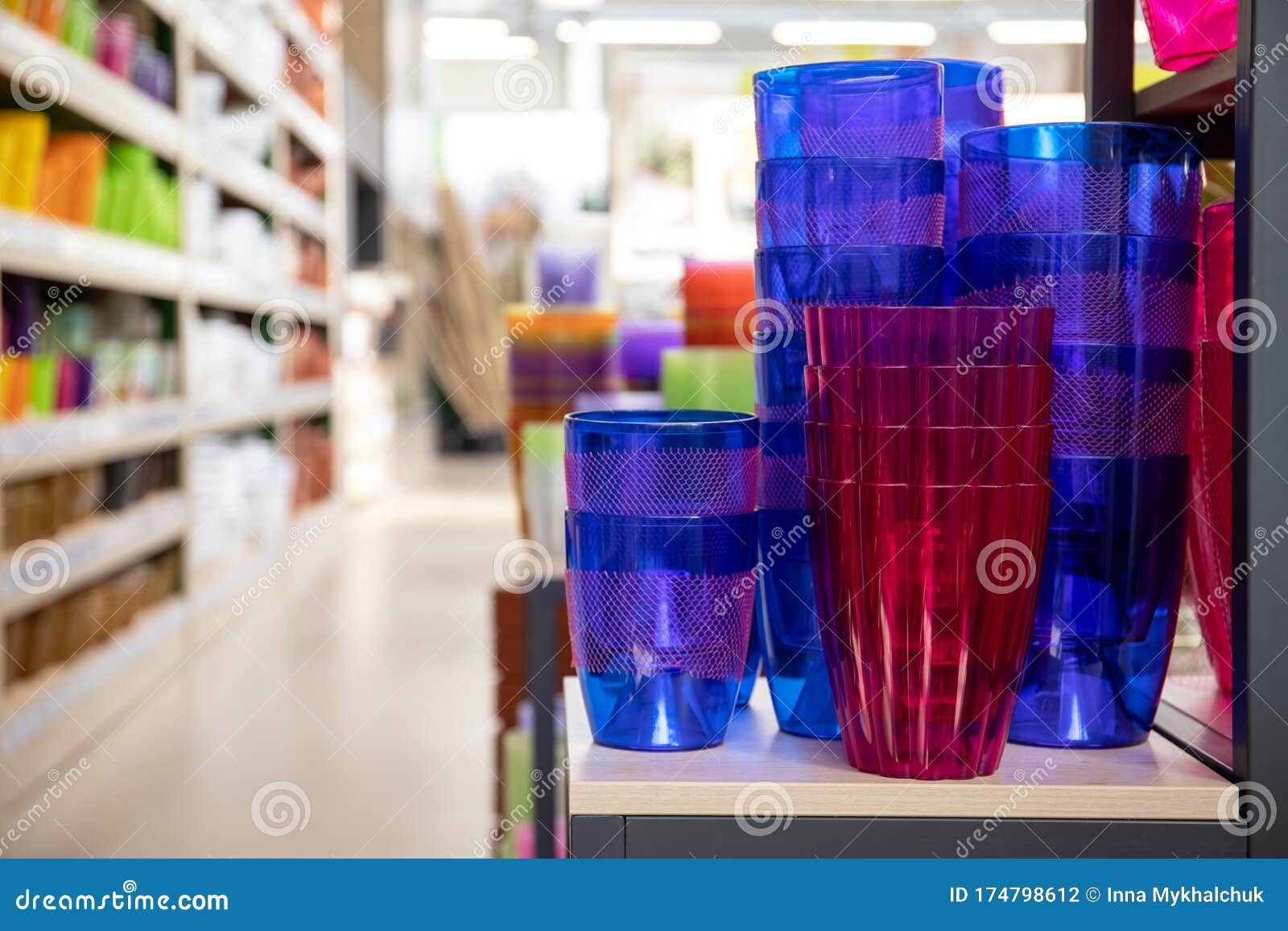 Bright Multi-colored Plastic Pots on a Shelf Stock Photo - Image of ...